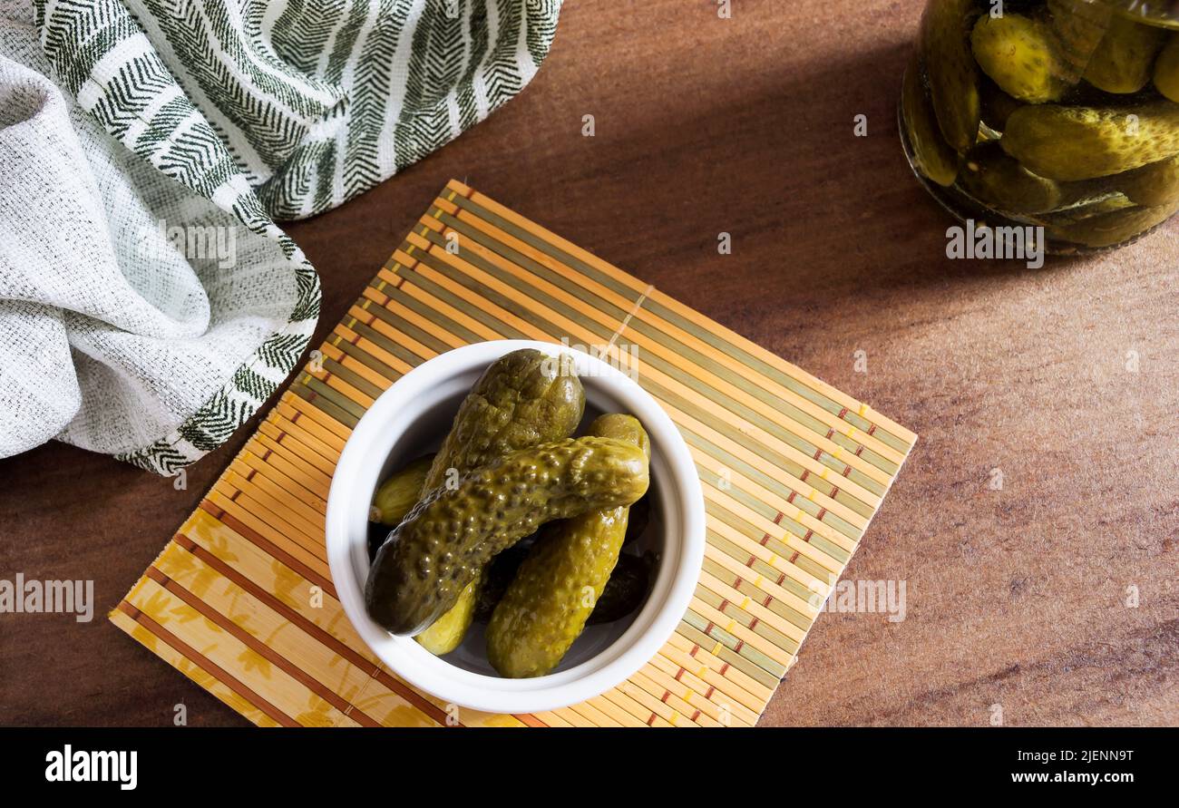 Pickled cucumber on bamboo mat photographed from above also has a ...