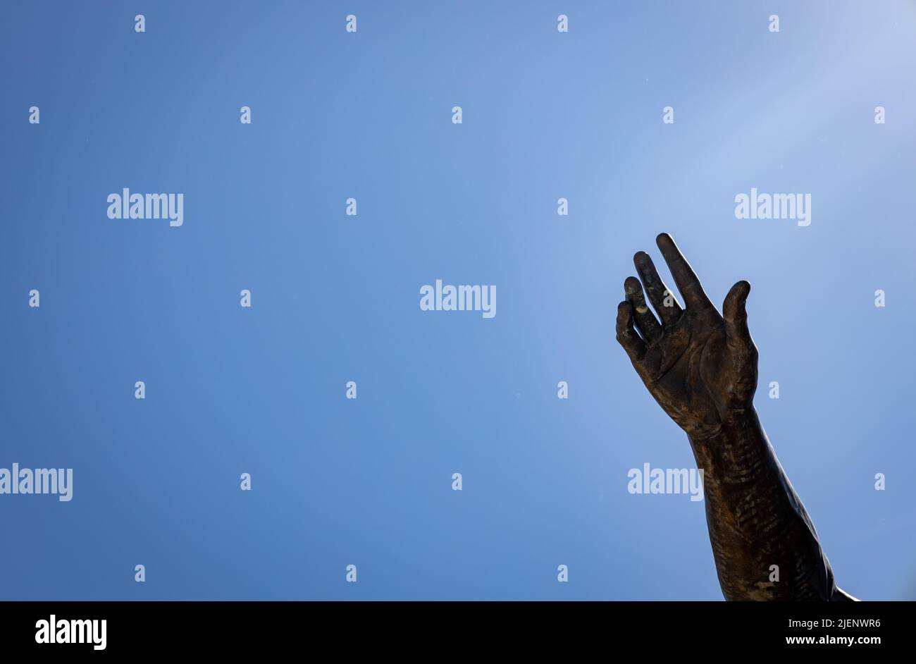 Hand pointing to the sky from a metal statue. Free space to write Stock ...