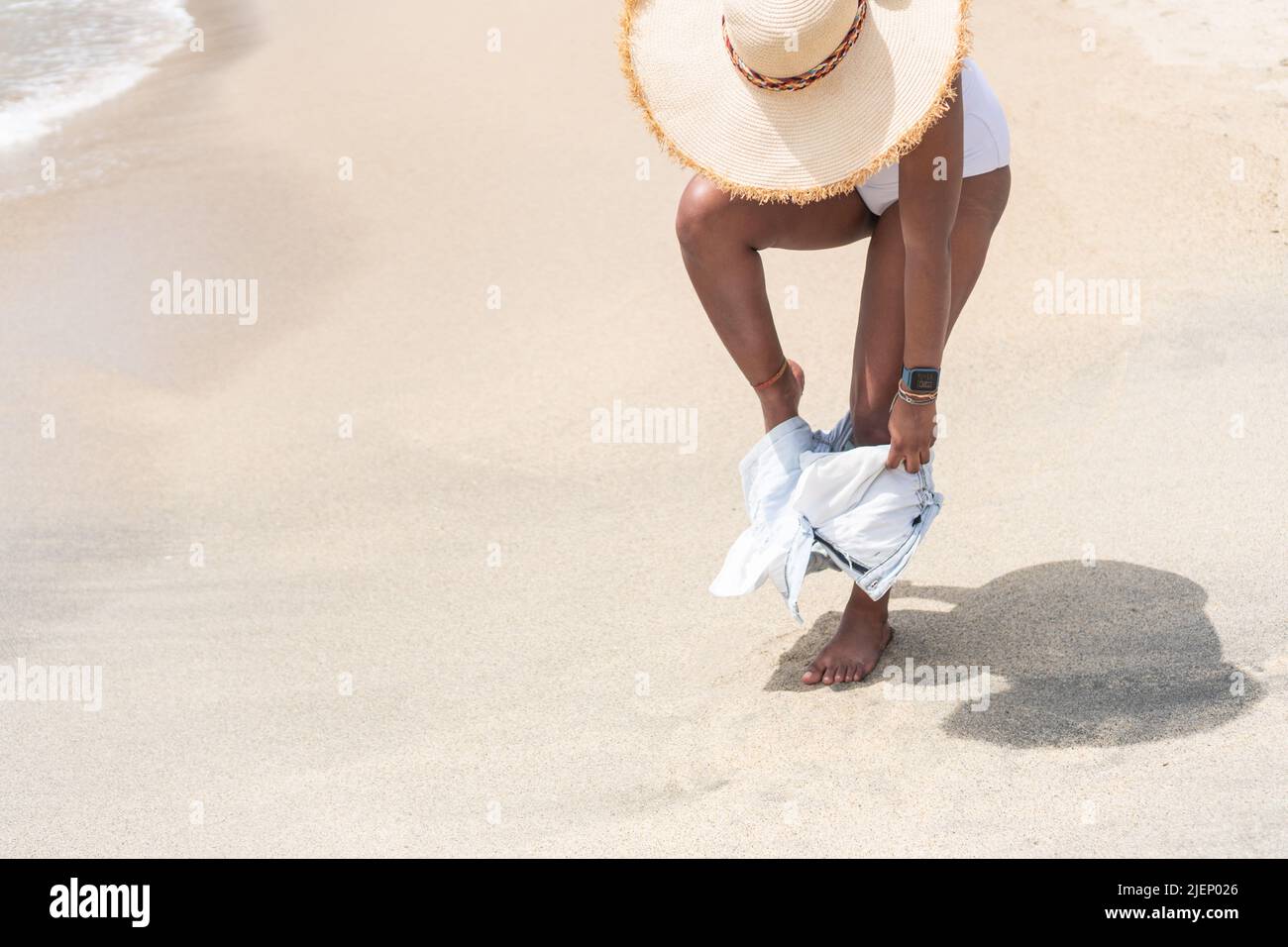 Woman taking clothes off hi-res stock photography and images - Alamy