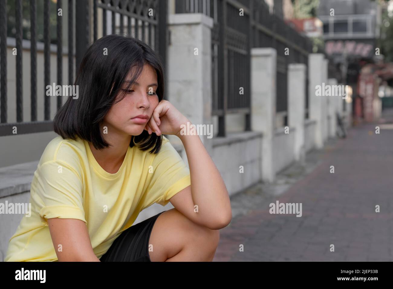 Homeless girl sitting on hi-res stock photography and images - Alamy