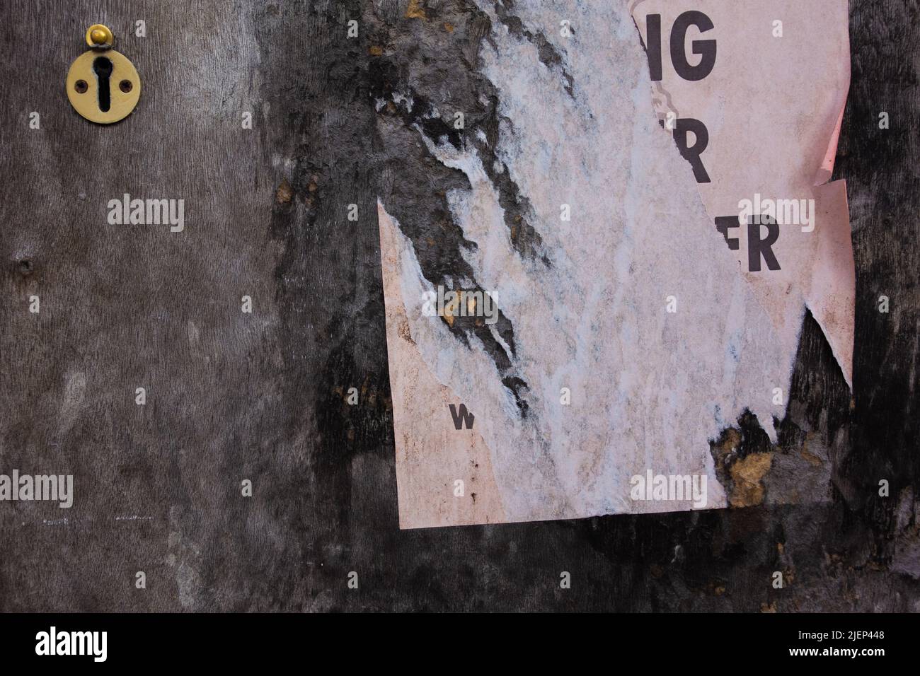 door lock and damaged poster Stock Photo - Alamy