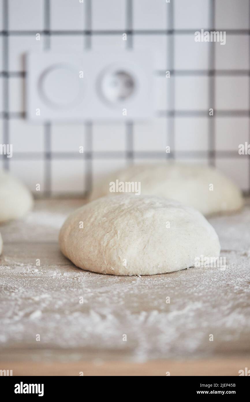 The process of making wheat bread at home. Dough shaping. The concept ...