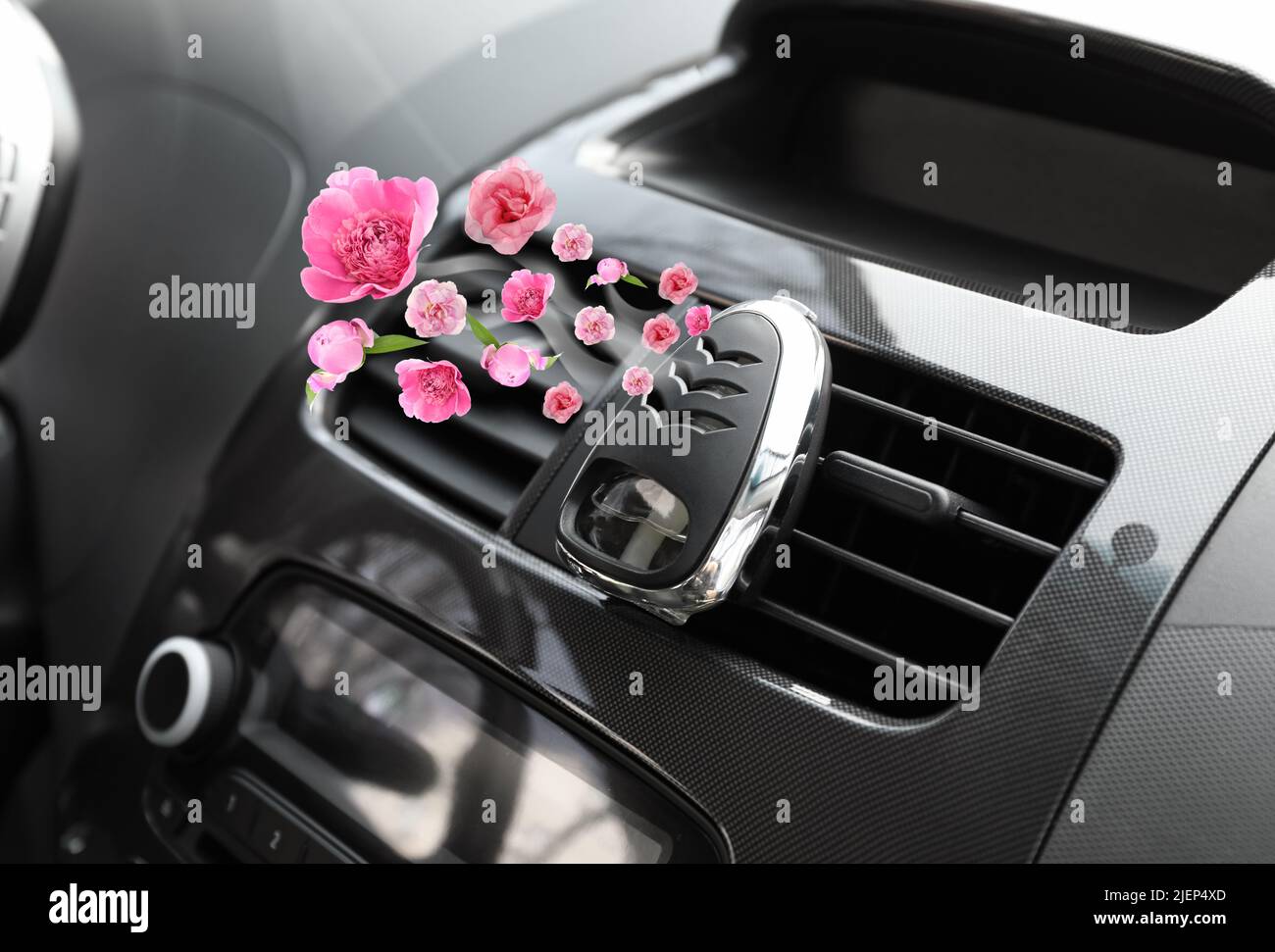 Aroma air freshener with flying fresh pink flowers in car salon Stock ...