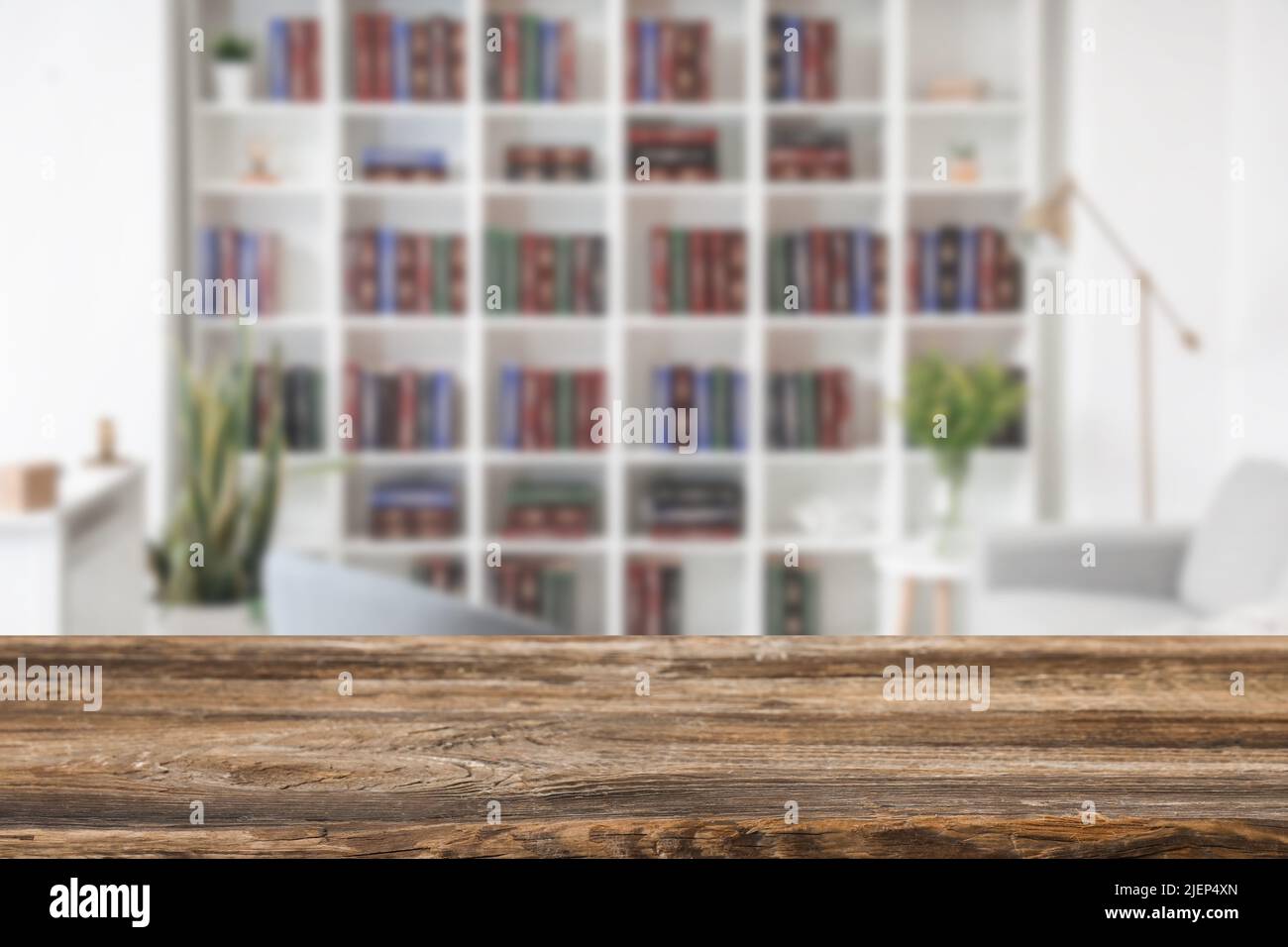 Empty wooden table in home library Stock Photo - Alamy