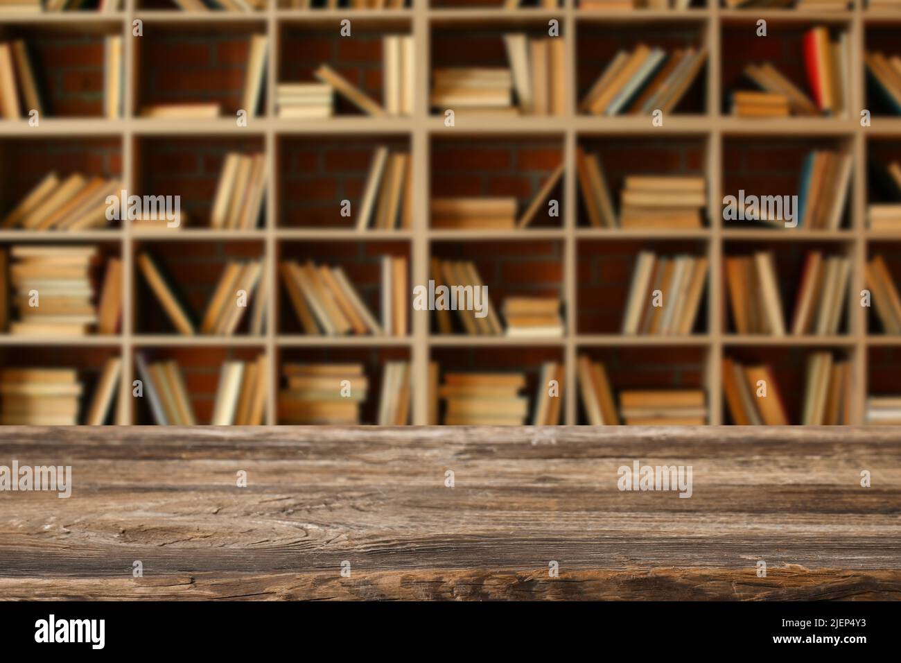 Empty wooden table in modern library Stock Photo - Alamy