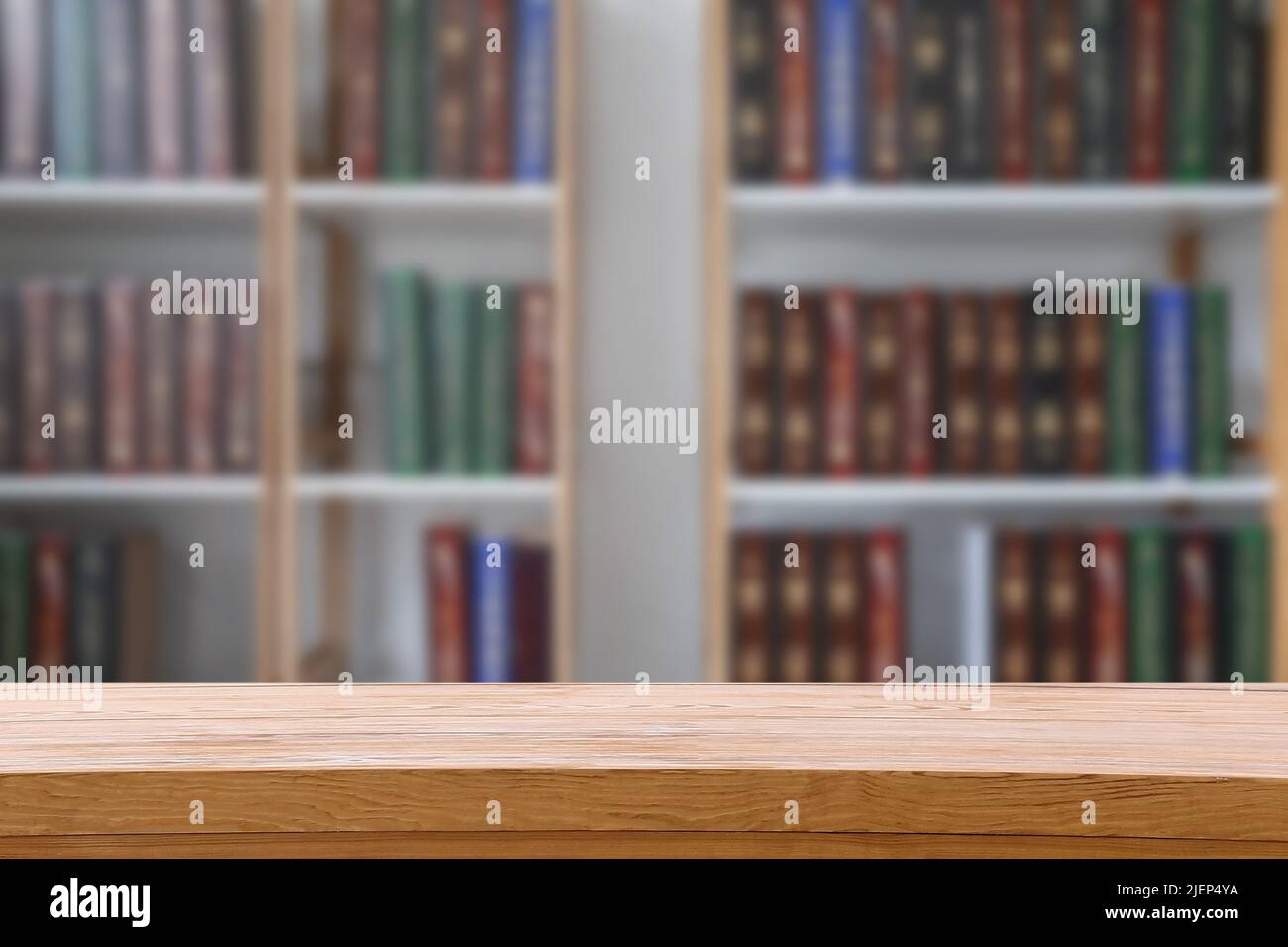 Empty wooden table in modern library Stock Photo - Alamy
