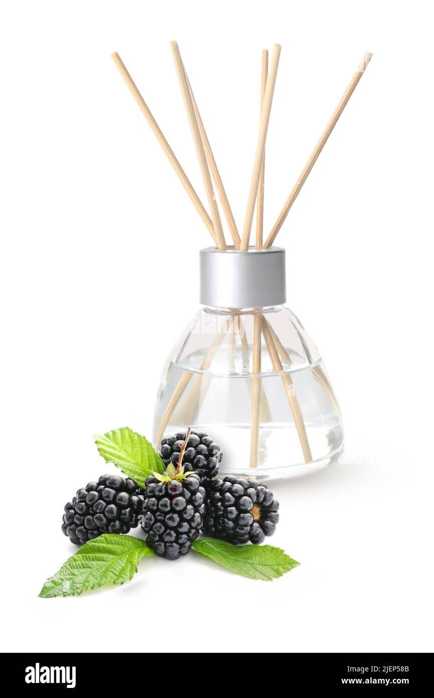 Reed diffuser and blackberry on white background Stock Photo - Alamy