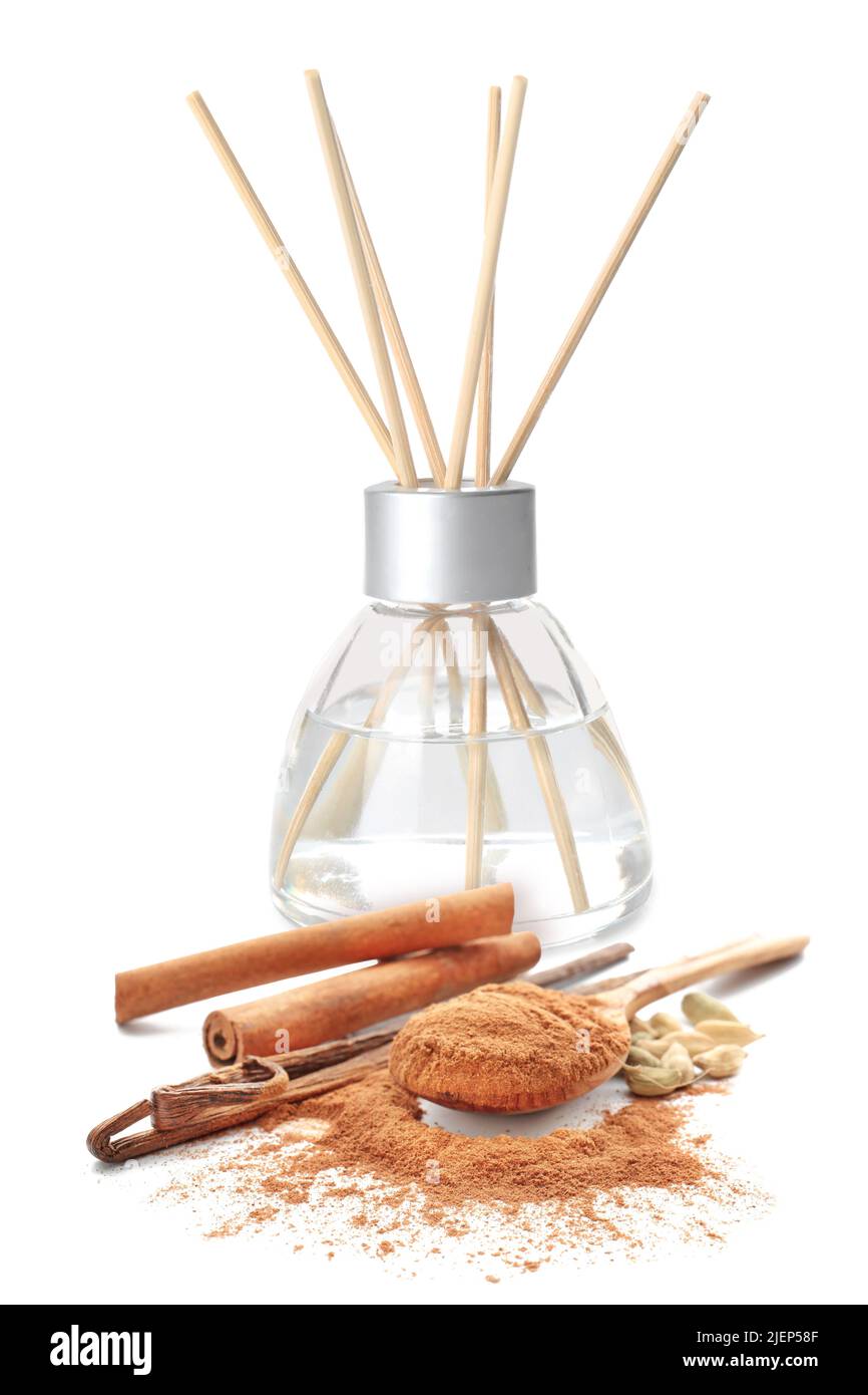 Reed diffuser and spices on white background Stock Photo - Alamy