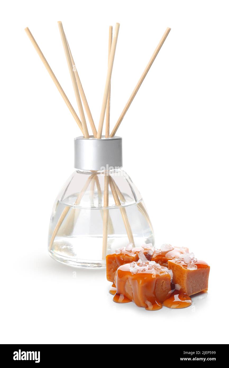 Reed diffuser and caramel on white background Stock Photo - Alamy