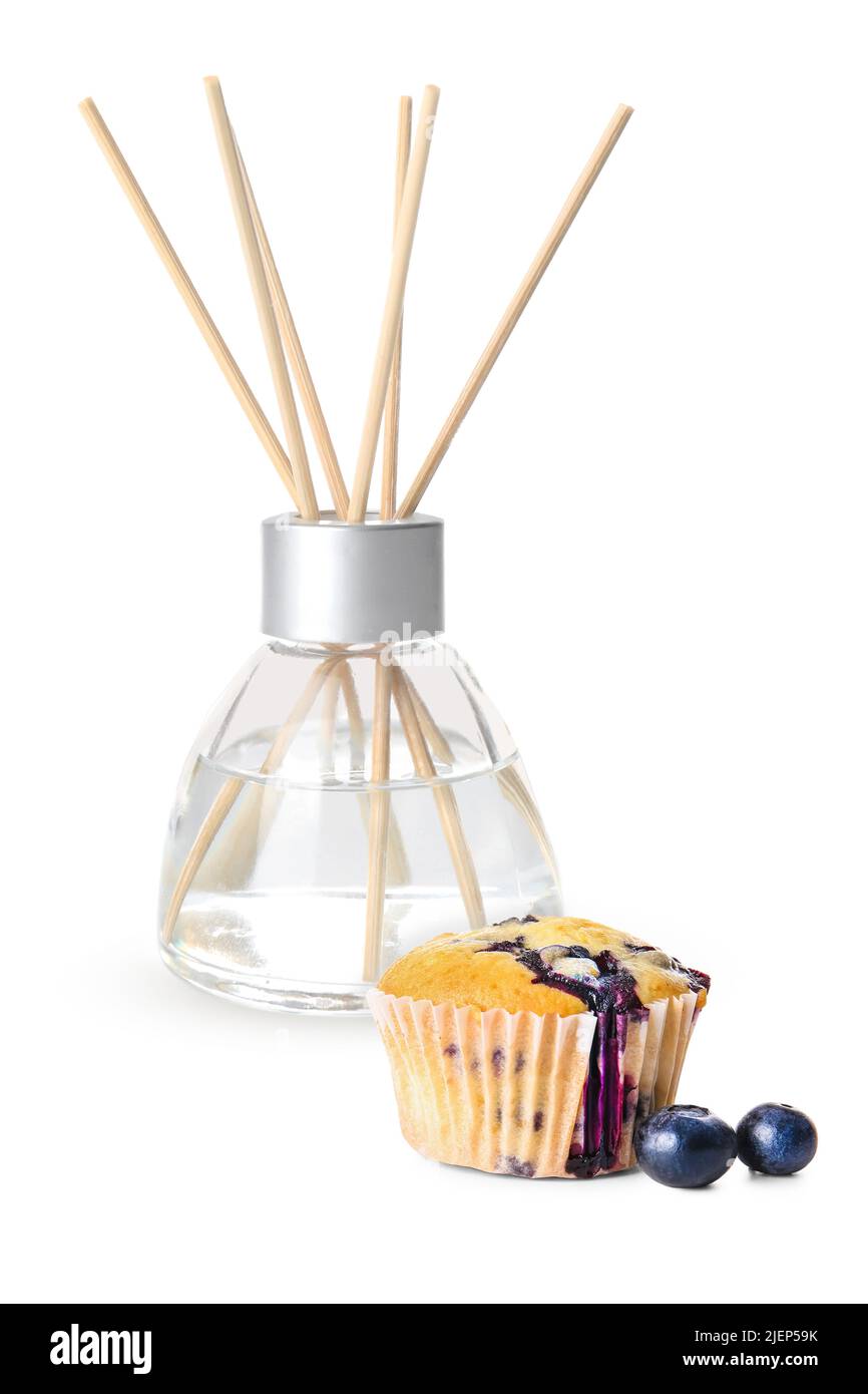 Reed diffuser and cake on white background Stock Photo - Alamy