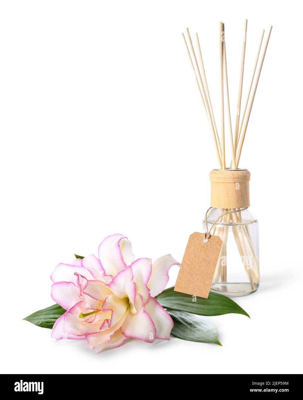 Reed diffuser and lily on white background Stock Photo - Alamy