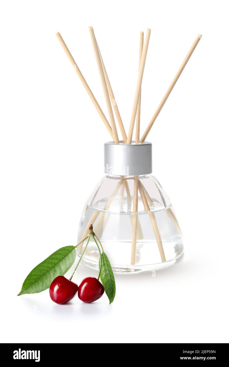 Reed diffuser and cherry on white background Stock Photo - Alamy