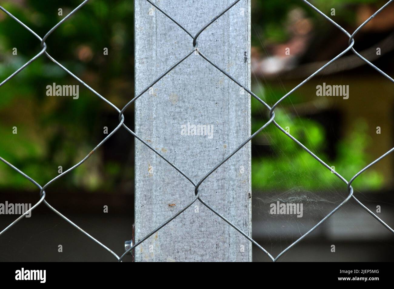 Home yard fence security wire Stock Photo - Alamy