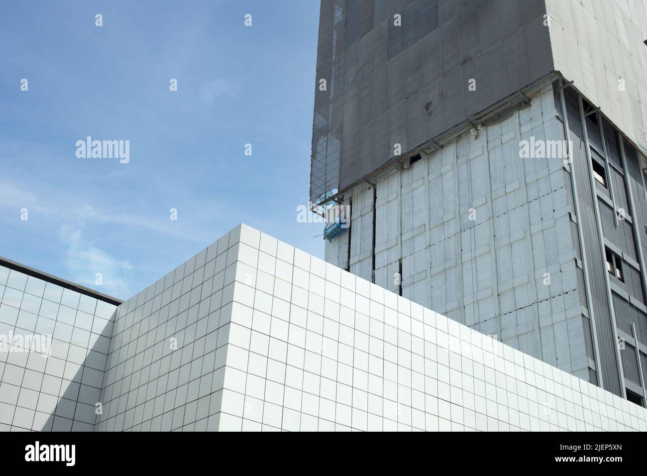 Professional workers with wash tools on mirror exterior Building panels ...