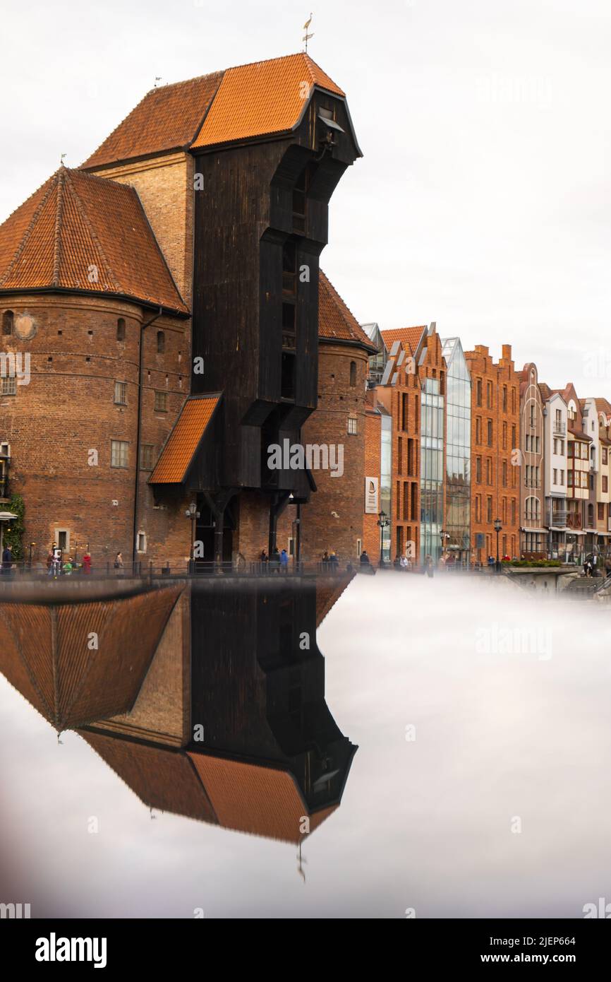 Ancient crane - zuraw Old town in Gdansk. The riverside on Granary ...