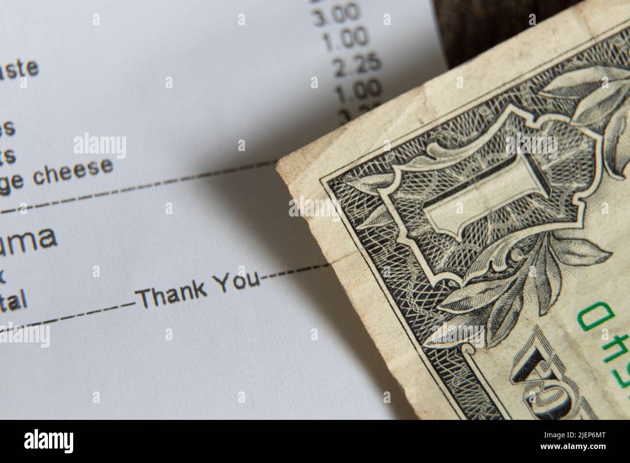 a check from the supermarket is on the table, a paper check with ...