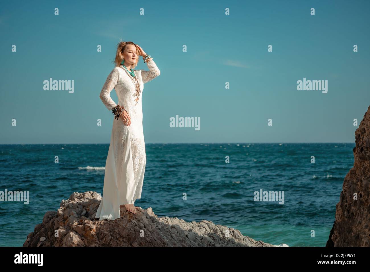 Woman in bohemian clothing on beach at sunset. Boho style for ...