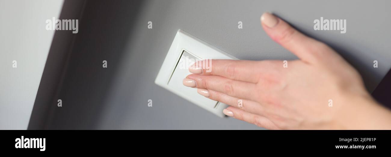 Womans hand light switch hi-res stock photography and images - Alamy