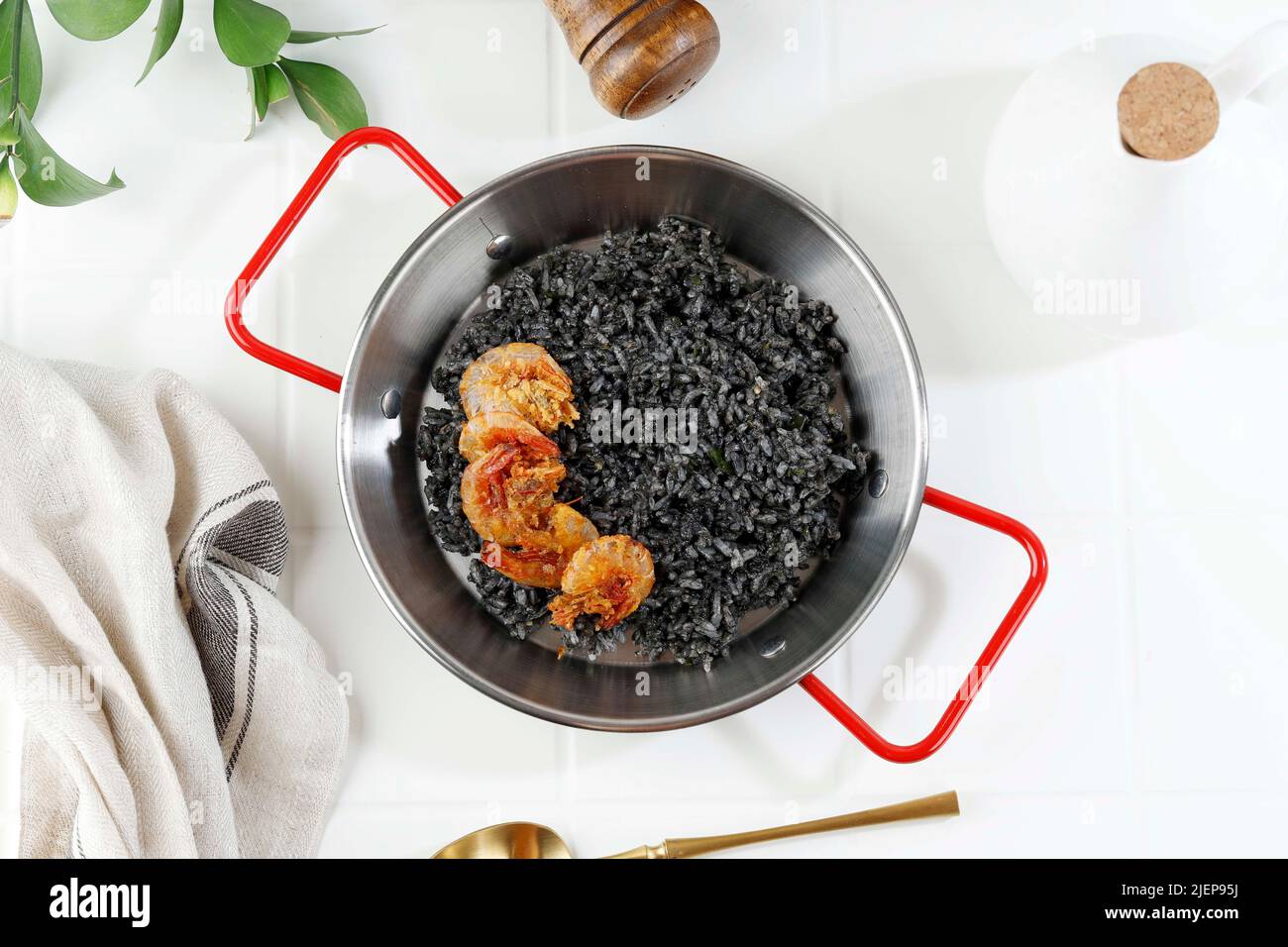 Black Spanish Rice paella with Squid Ink and Fried Shrimp as Topping ...