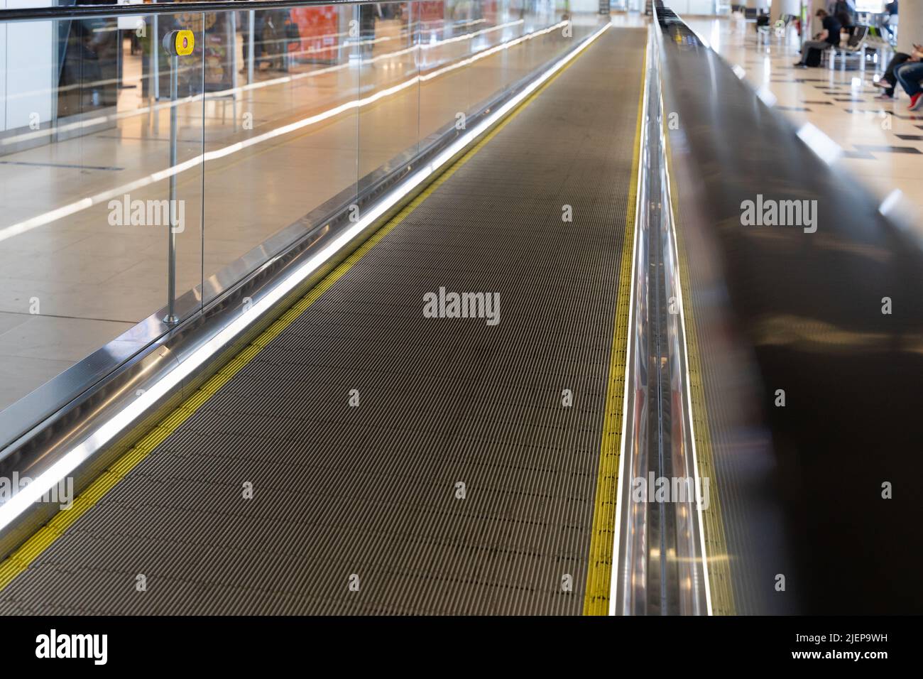 Empty moving walkway at airport. Comfort transportation to terminal ...