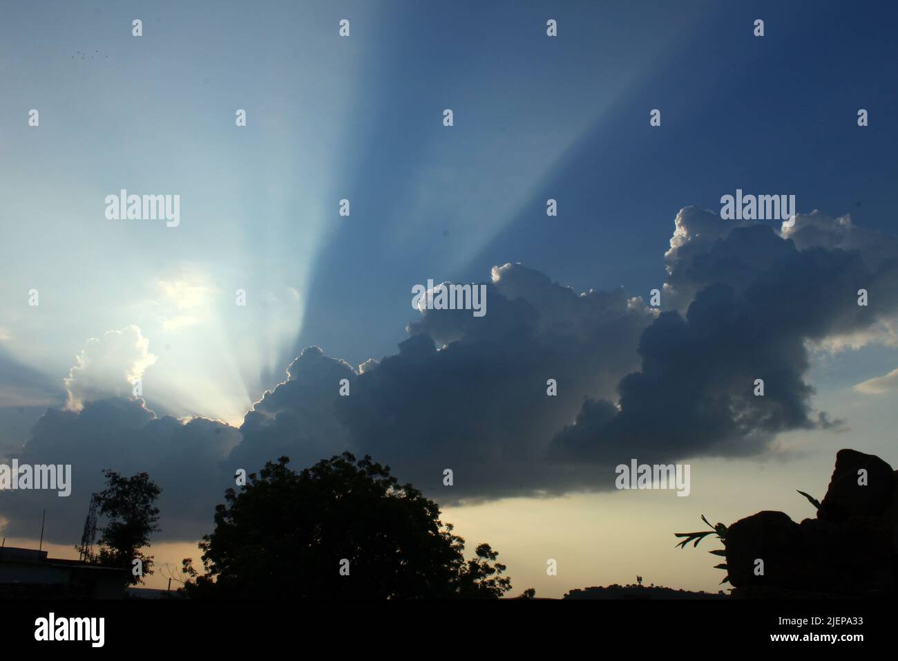 Sun rays coming out of the cloud hi-res stock photography and images ...