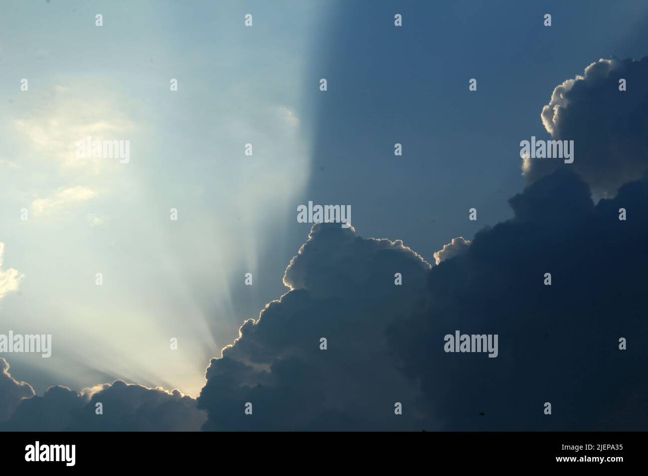 Sun rays coming out of the cloud hi-res stock photography and images ...
