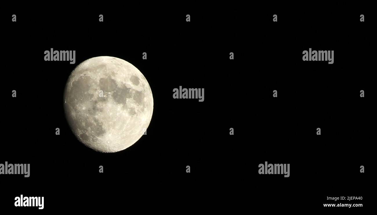 The bright crescent moon hangs over Earth all the time Stock Photo - Alamy