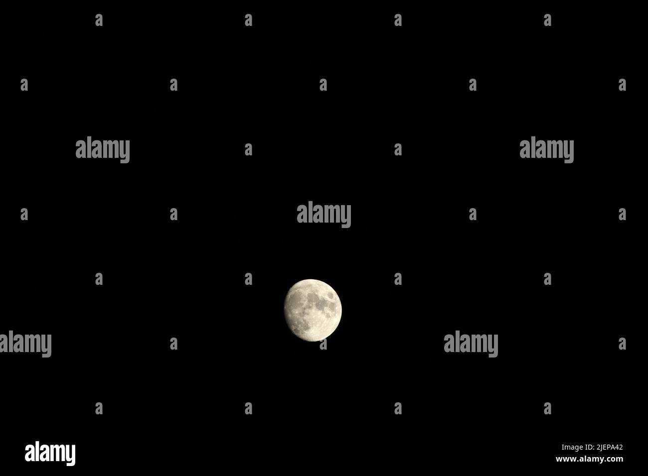 The bright crescent moon hangs over Earth all the time Stock Photo - Alamy