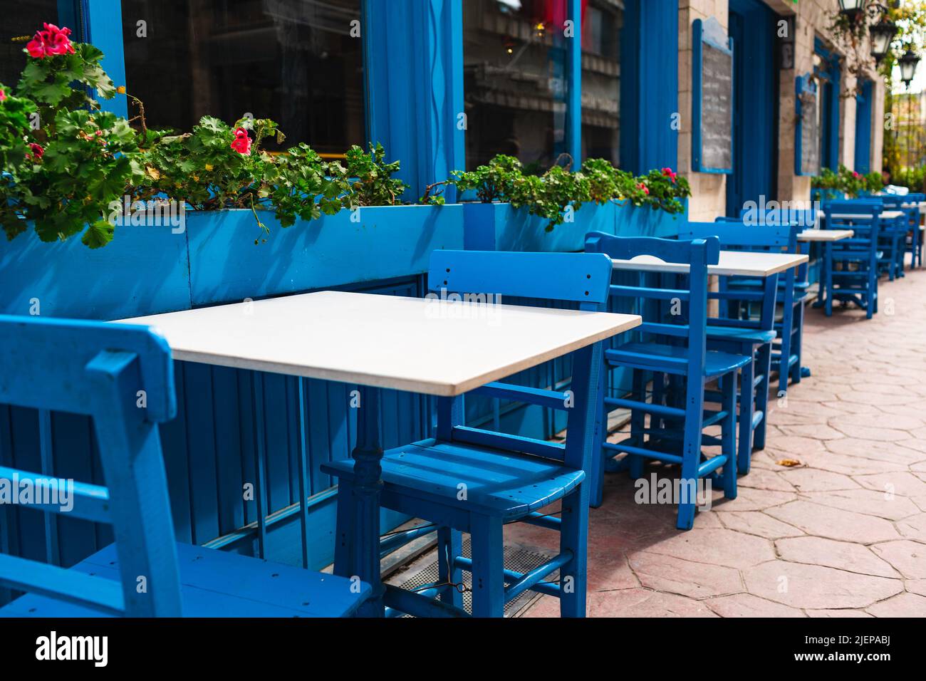 Street cafe in blue tones, empty tables in Istanbul Stock Photo - Alamy