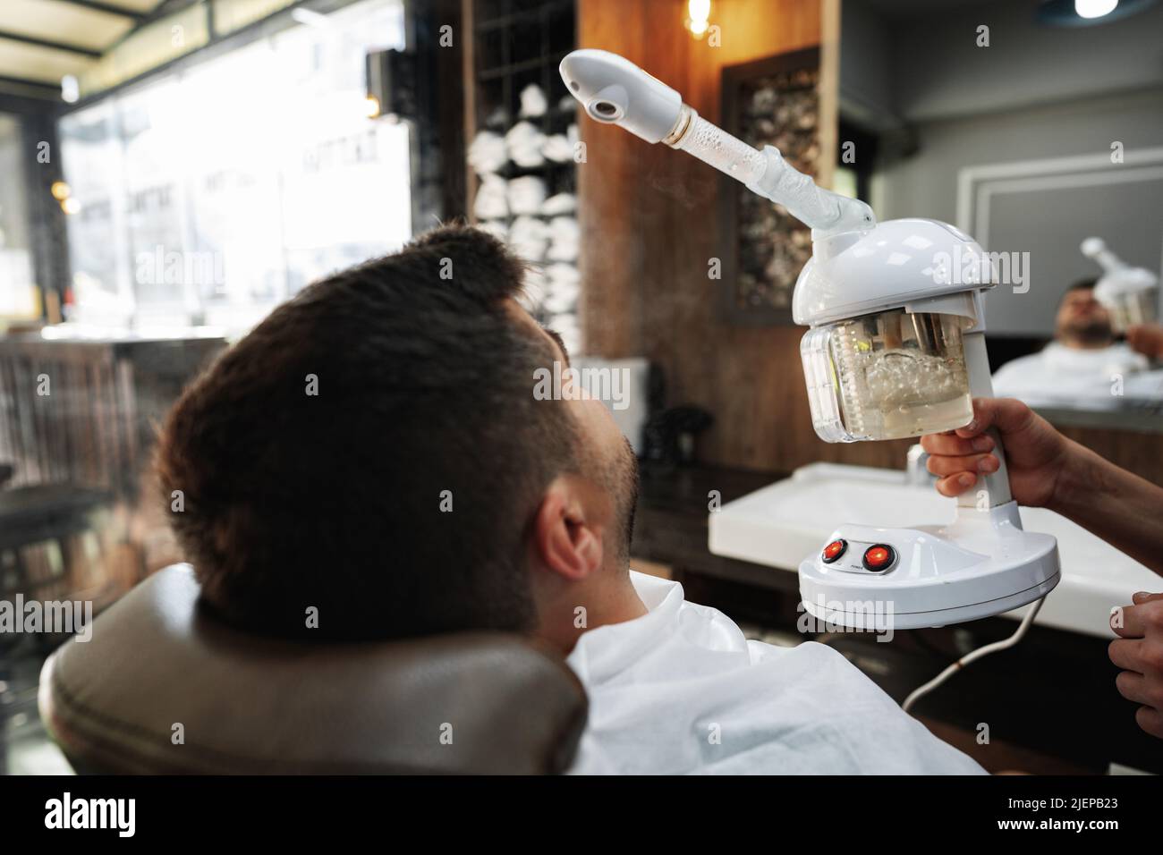 Steam machine in barbershop, professional shaving service Stock Photo ...