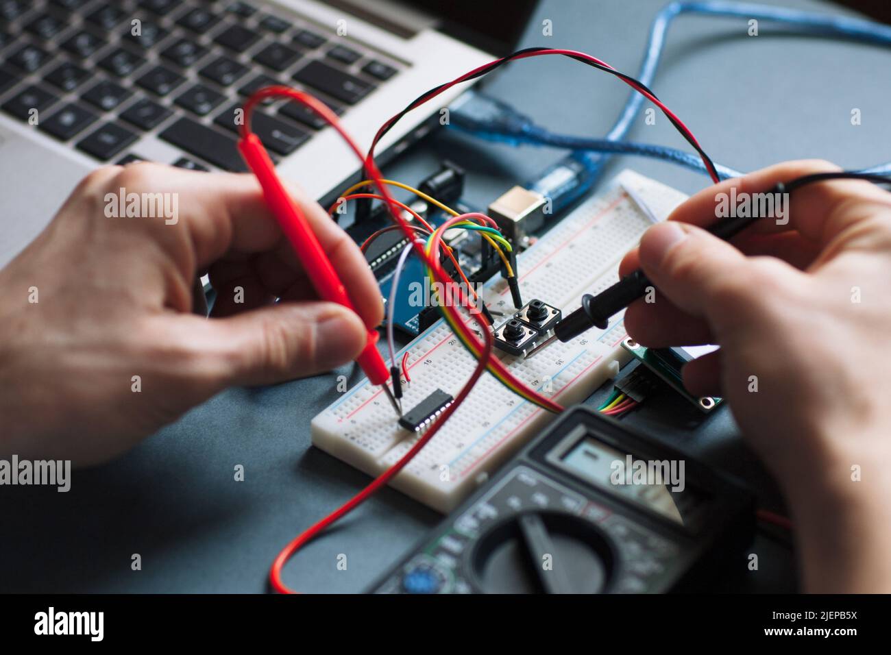 Repairman fixing problems with portable computer Stock Photo - Alamy