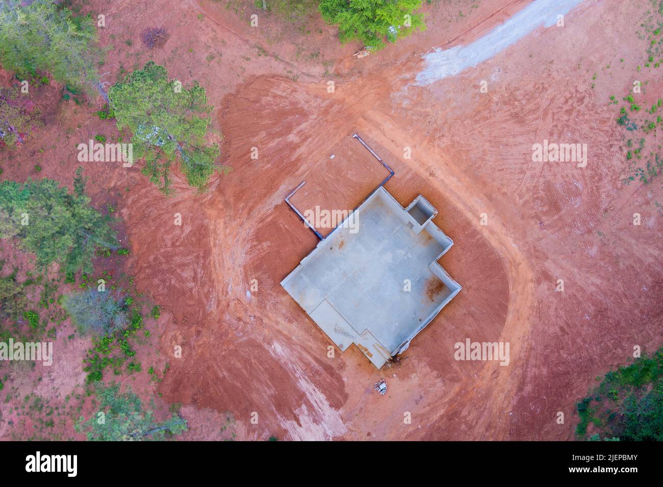 View of the new home foundation with concrete from an aerial ...