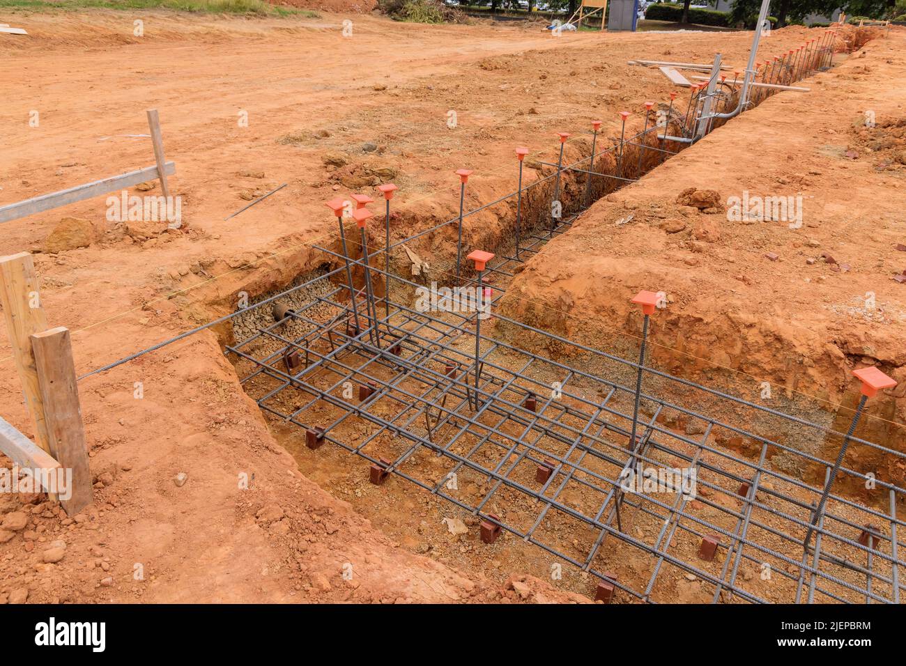 Putting steel in a trench for a house foundation Stock Photo - Alamy