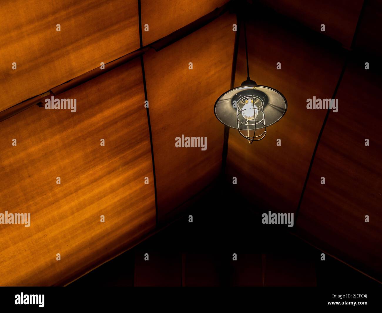 Old retro style lamp hanging on the ceiling inside the large glamping ...