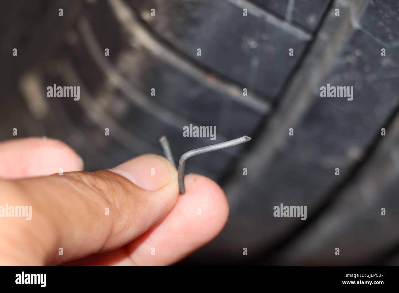 Nail trap and sharp on the road Stock Photo - Alamy
