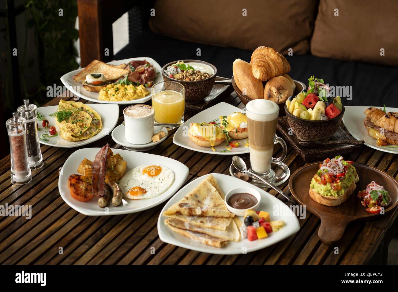 many mixed western breakfast food items on cafe table Stock Photo - Alamy