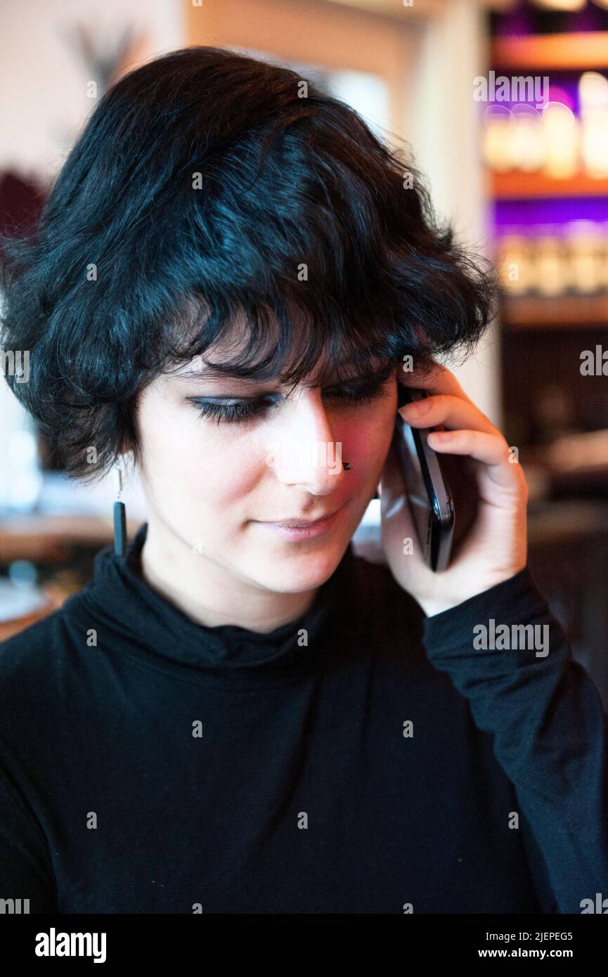 Tilburg, Netherlands. Young adult caucasian woman performing an ...