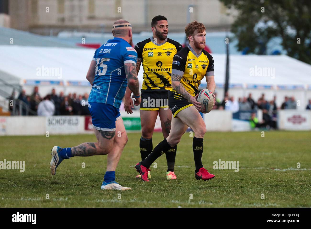 Joe Keyes of Halifax breaks whilst watched by team mate Kevin Larroyer ...