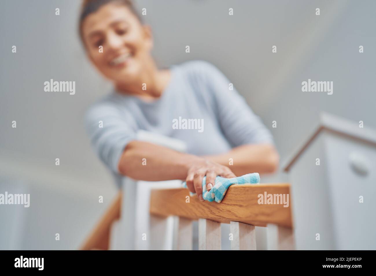 Picture of woman cleaning stair steps or railing Stock Photo - Alamy