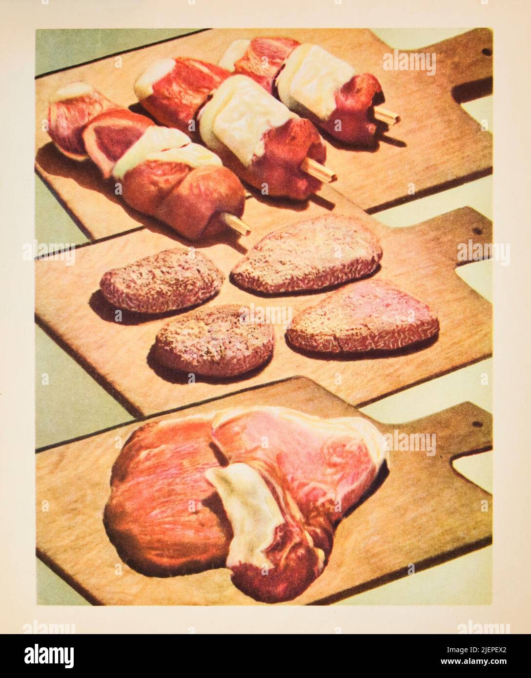 Different cuts of meat, beef on wood platters. Kebab, hamburger patties ...