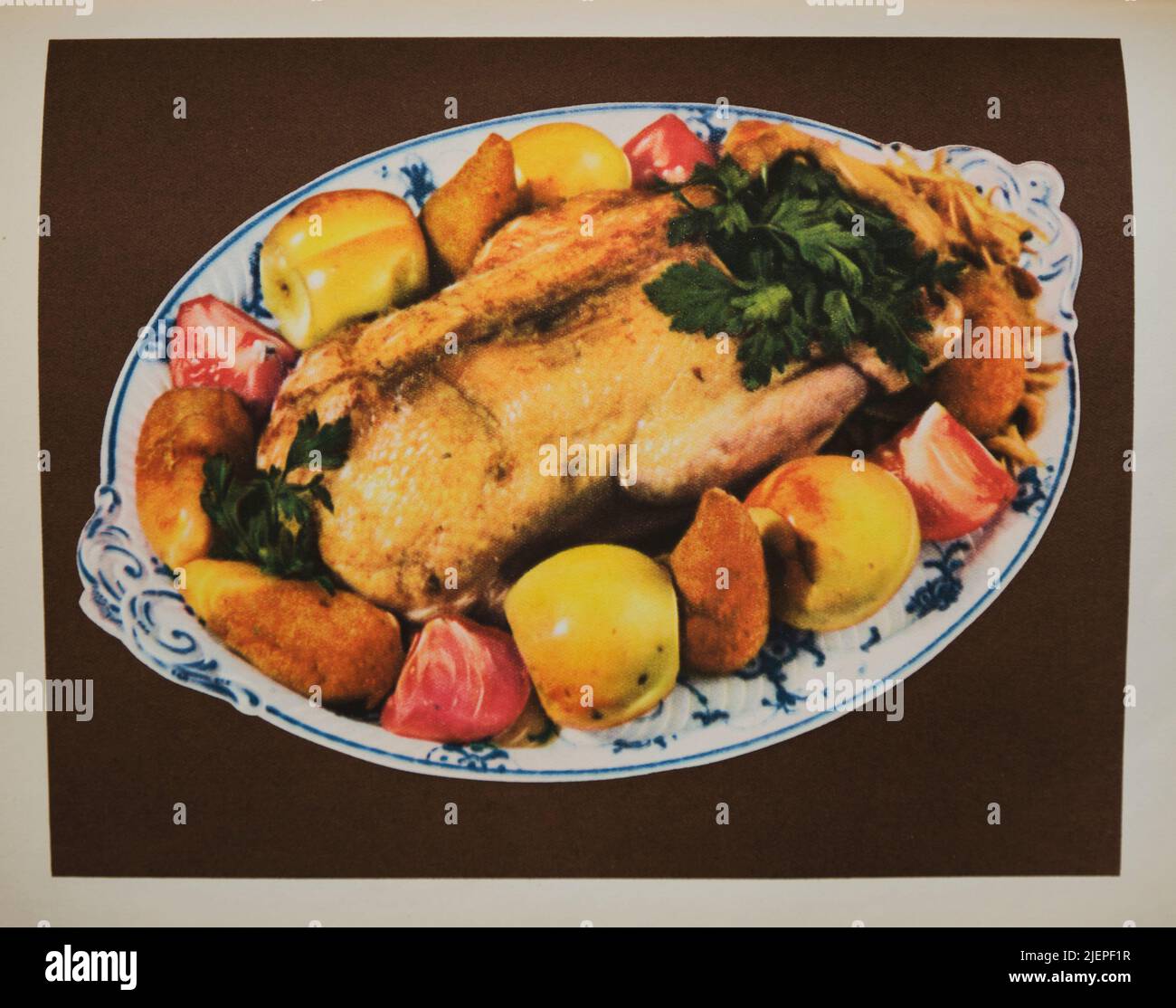 Baked, roasted chicken with apples, tomatoes. From the classic 1955 ...