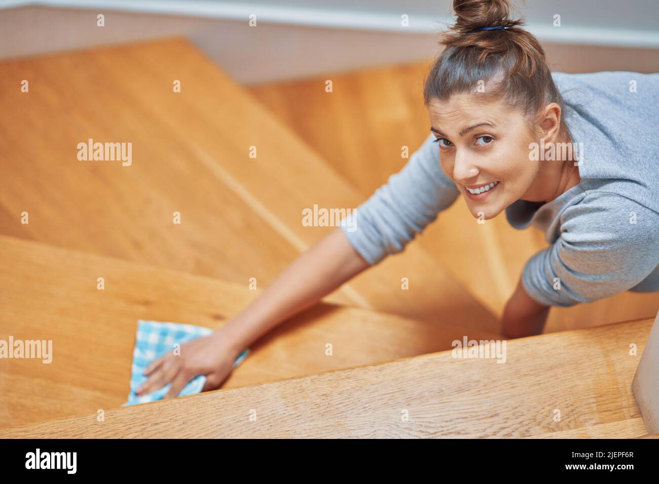 Picture of woman cleaning stair steps or railing Stock Photo - Alamy