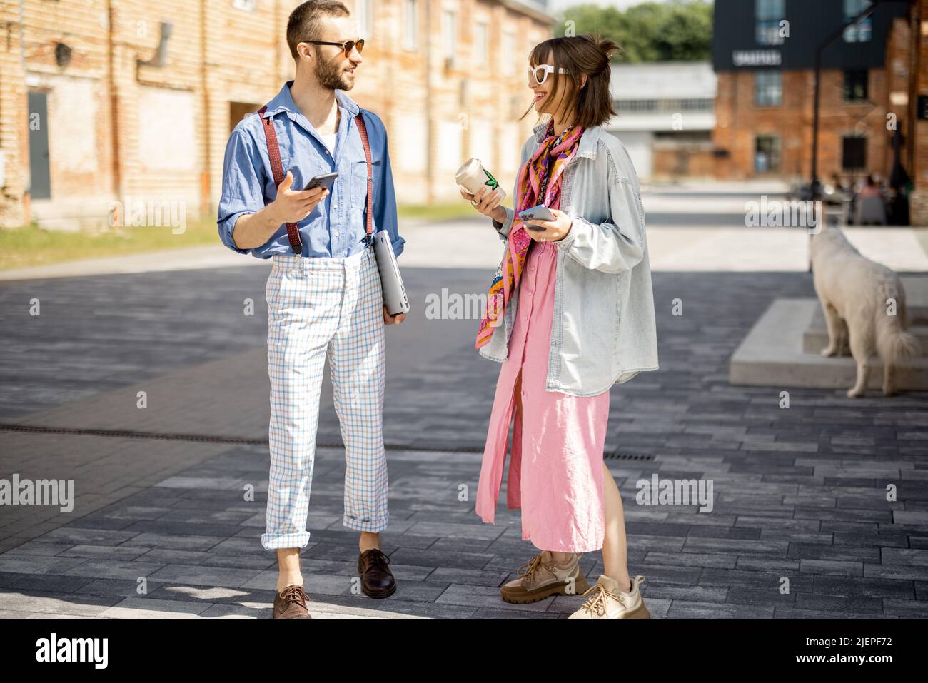 Young hipsters hang out together near office outdoors Stock Photo - Alamy