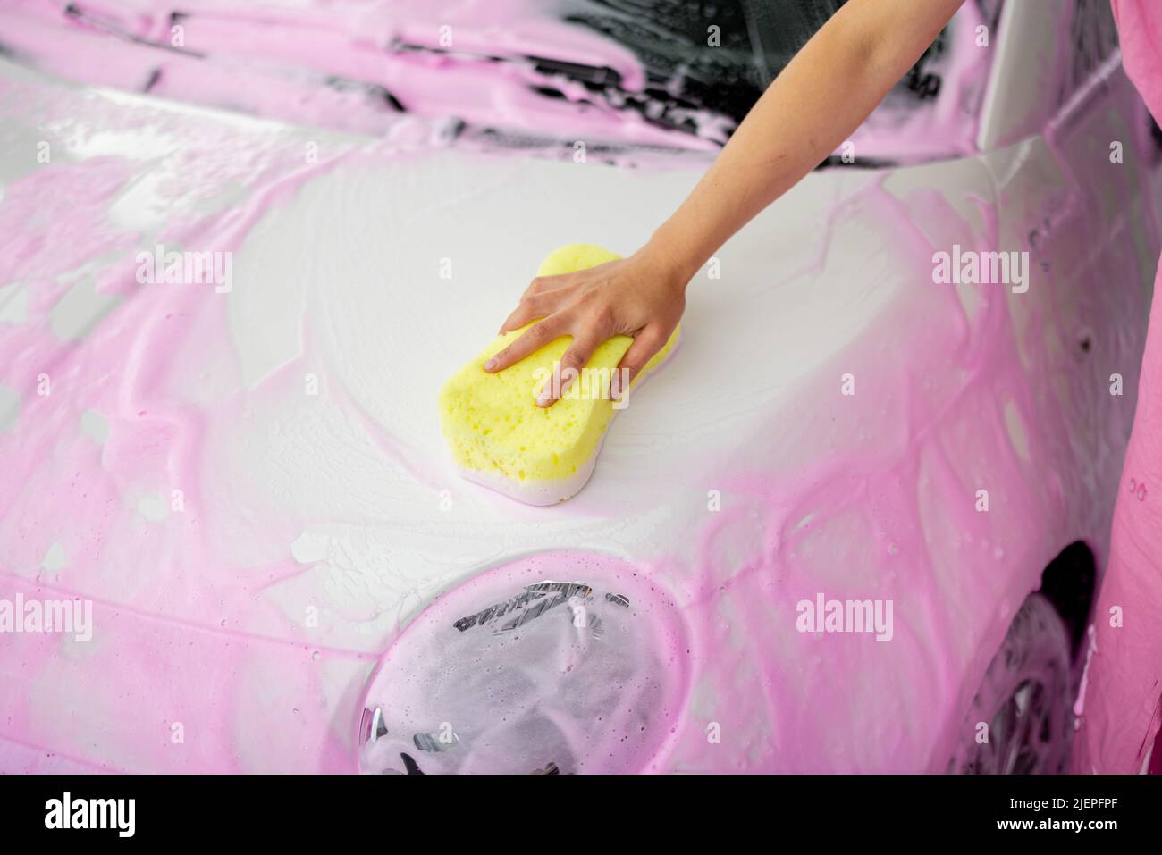 Wiping car hood sponge hi-res stock photography and images - Alamy
