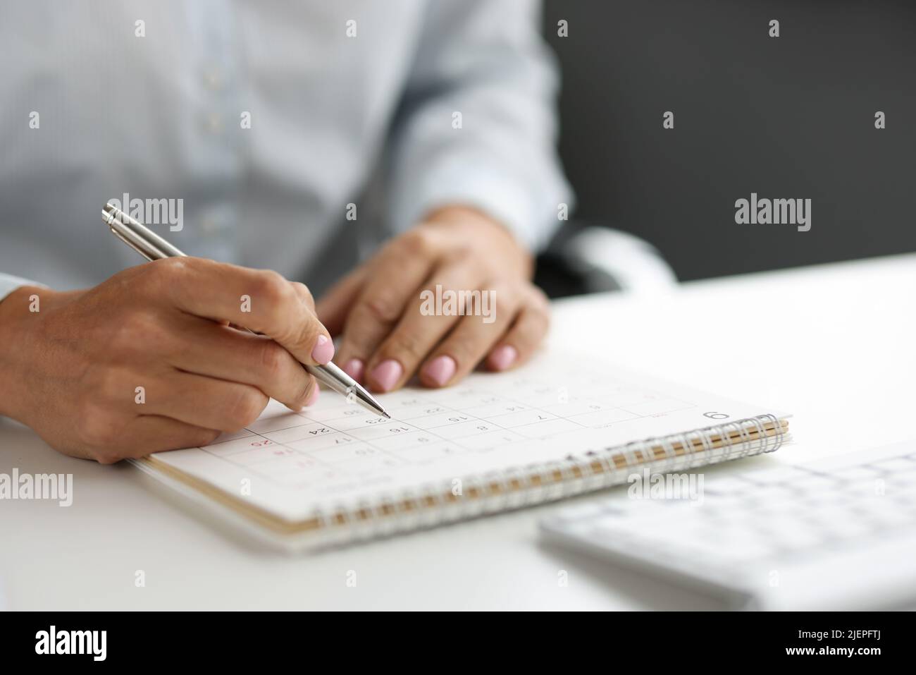 Business planning and businesswoman working and checking calendar at ...