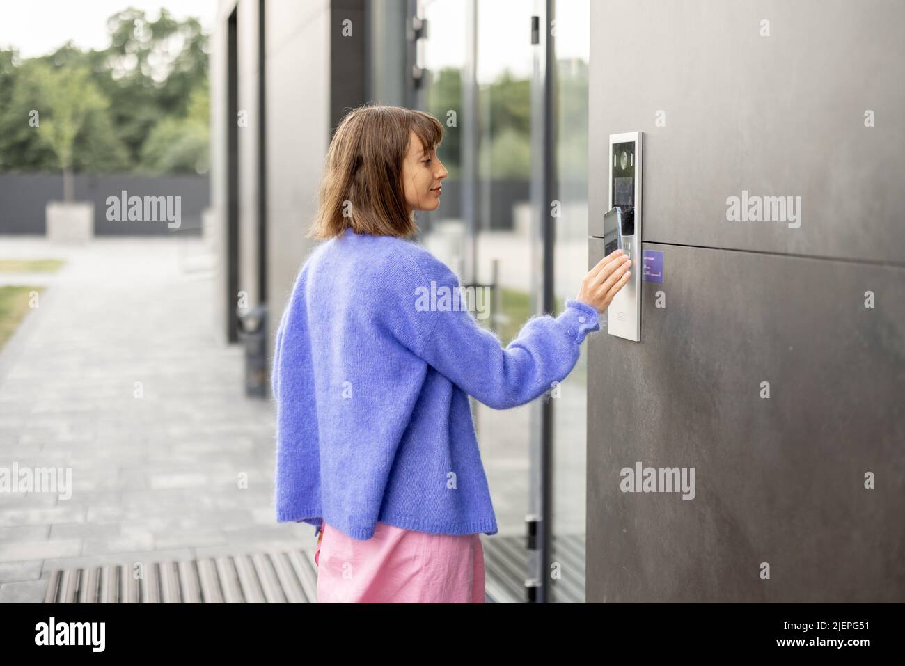 Woman young intercom system hi-res stock photography and images - Alamy