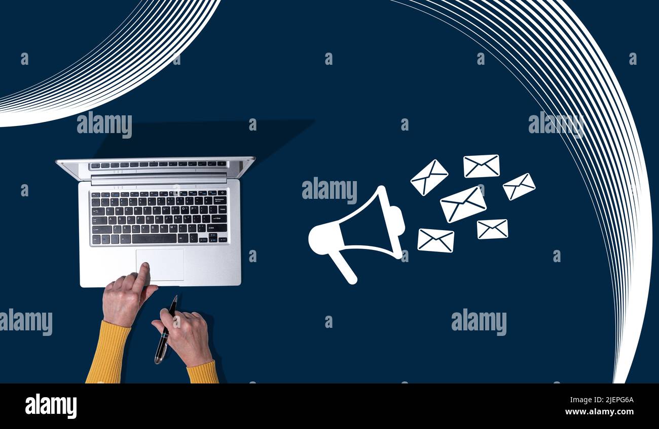 Top view of hands using laptop with symbol of email marketing concept ...