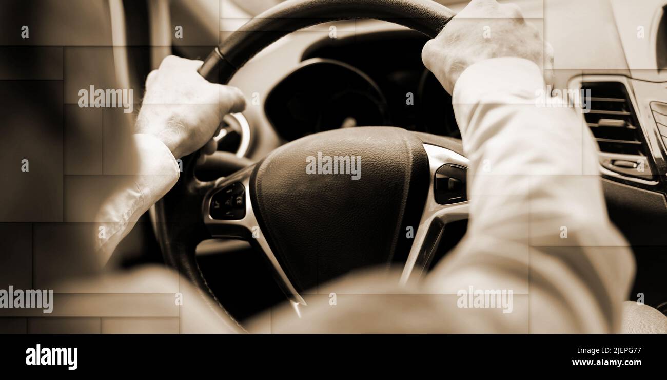 Man driving with his two hands on steering wheel, geometric pattern ...