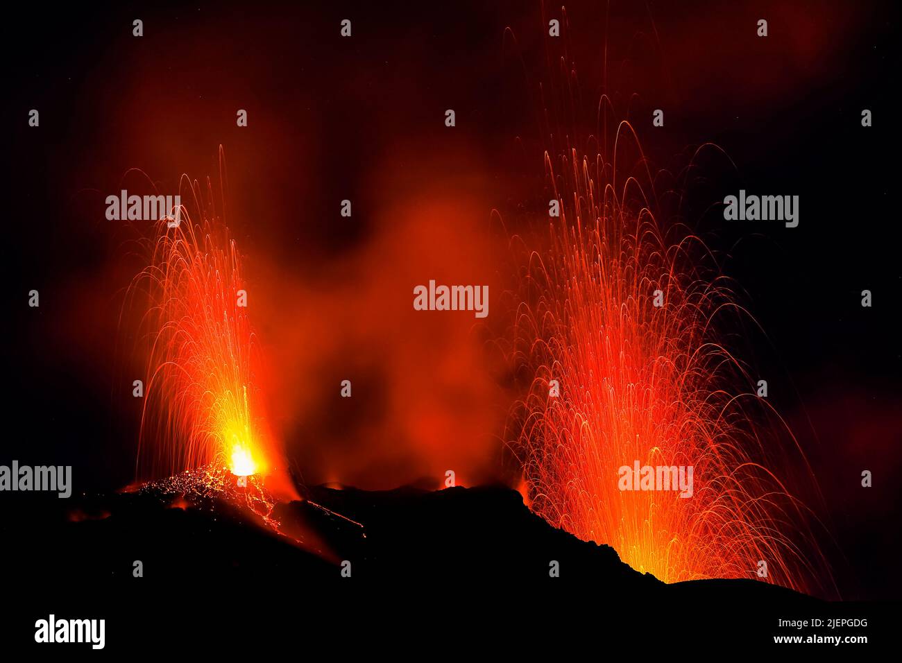 Lava bombs erupt from multiple vents at this volcano at night. This ...
