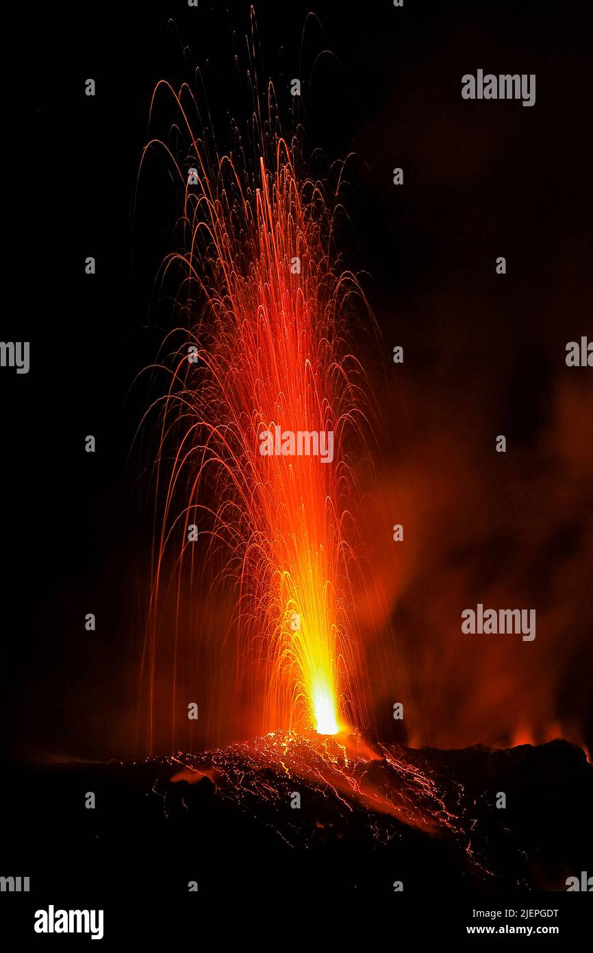 Lava bombs erupt from multiple vents at this volcano at night. This ...